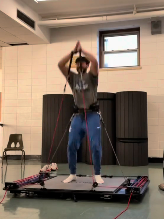 Athlete training with VertiMax resistance system